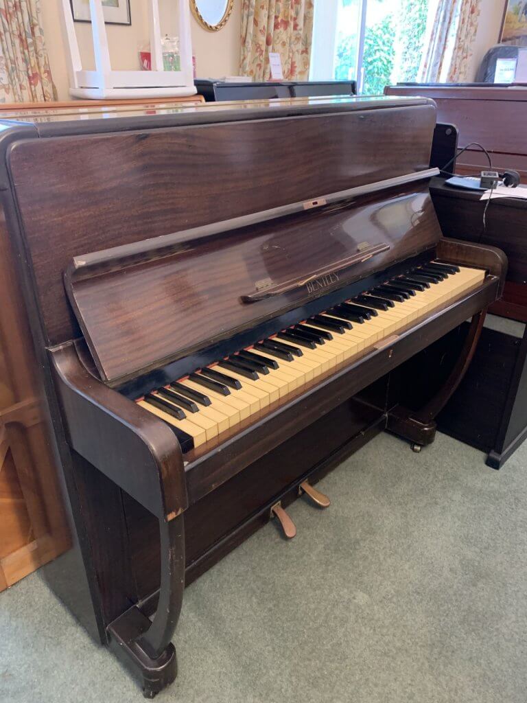 Bentley 6-Octave compact piano with wheels in dark mahogany